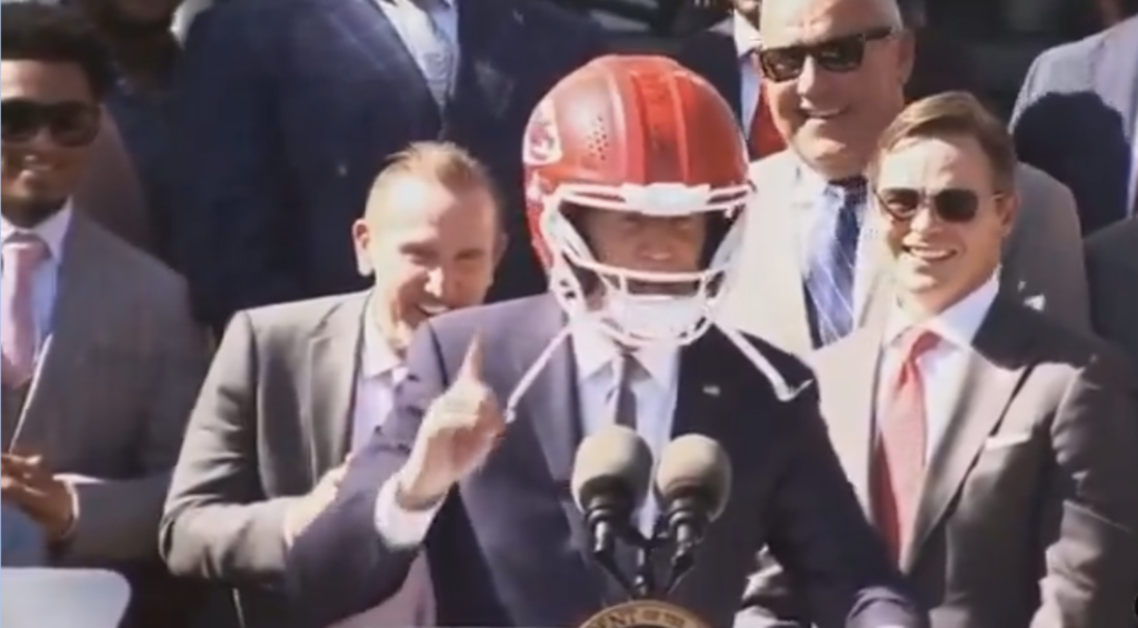 WATCH: Biden Bizarrely Puts On Chiefs Helmet, Mirrors Michael Dukakis ...